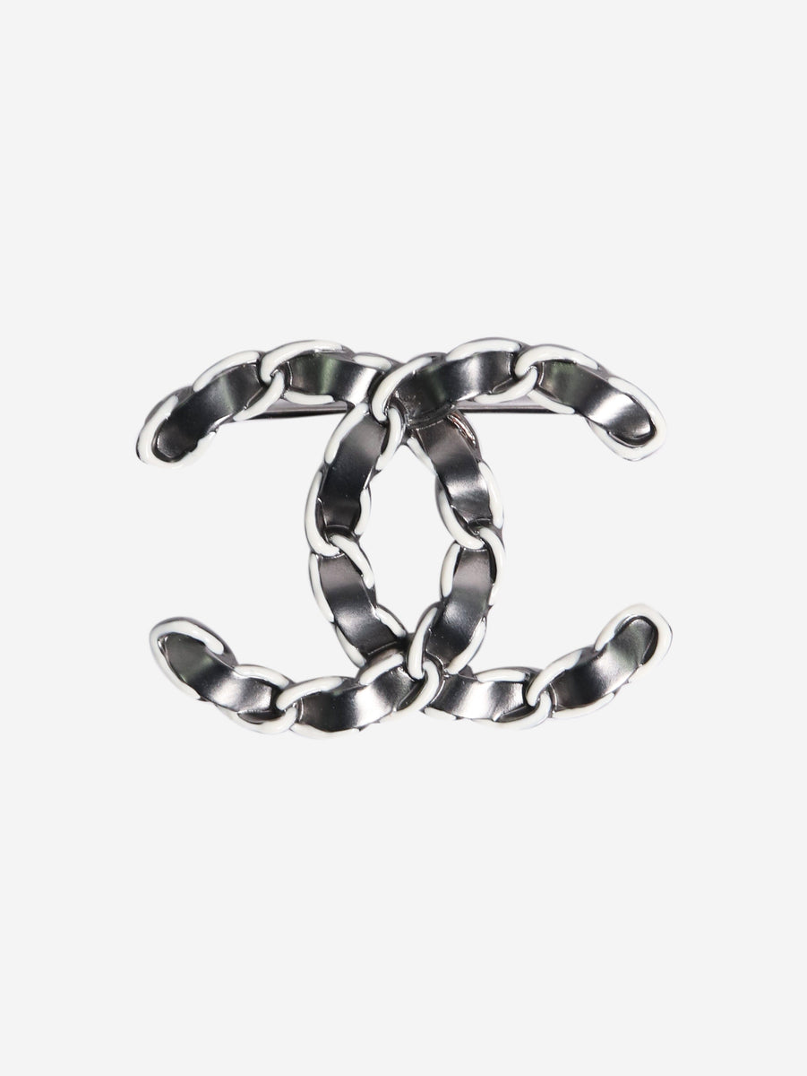Chanel pre-owned silver CC brooch | Sign of the Times
