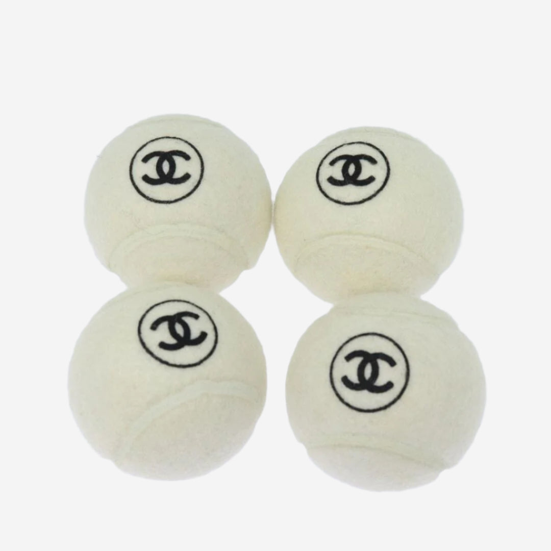 Chanel pre-owned black CC tennis racket and balls set | Sign of the Times